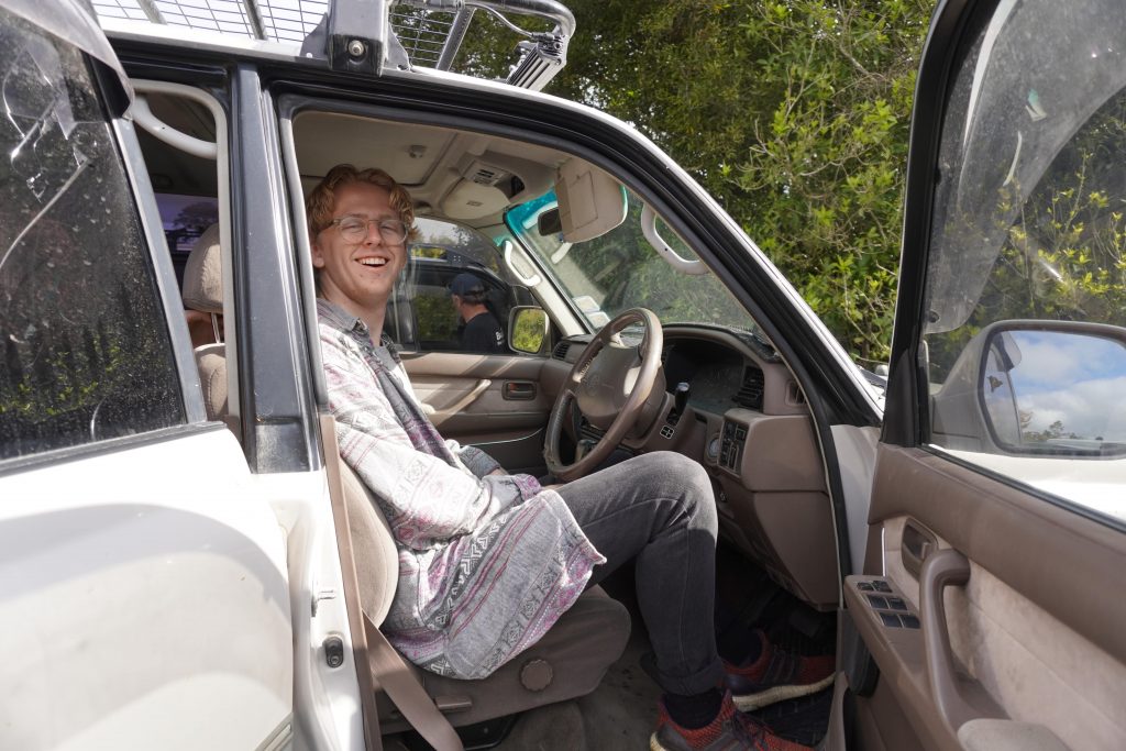 aaron in car – Magnify